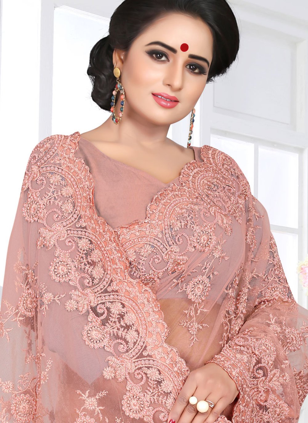 Wonderous Pink Embroidered Net Saree